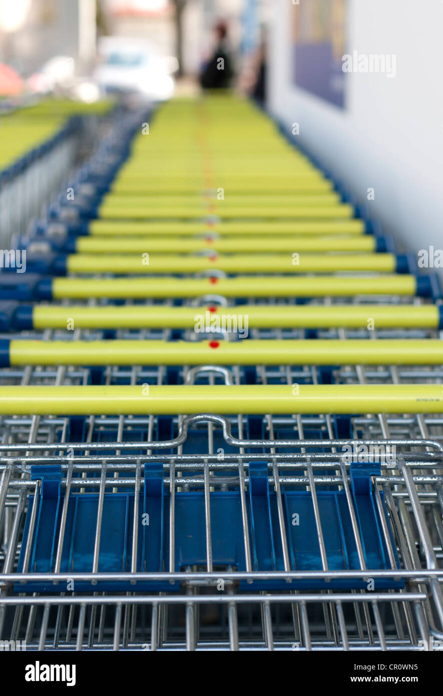 Shopping cart in shop abstract background Stock Photo - Alamy