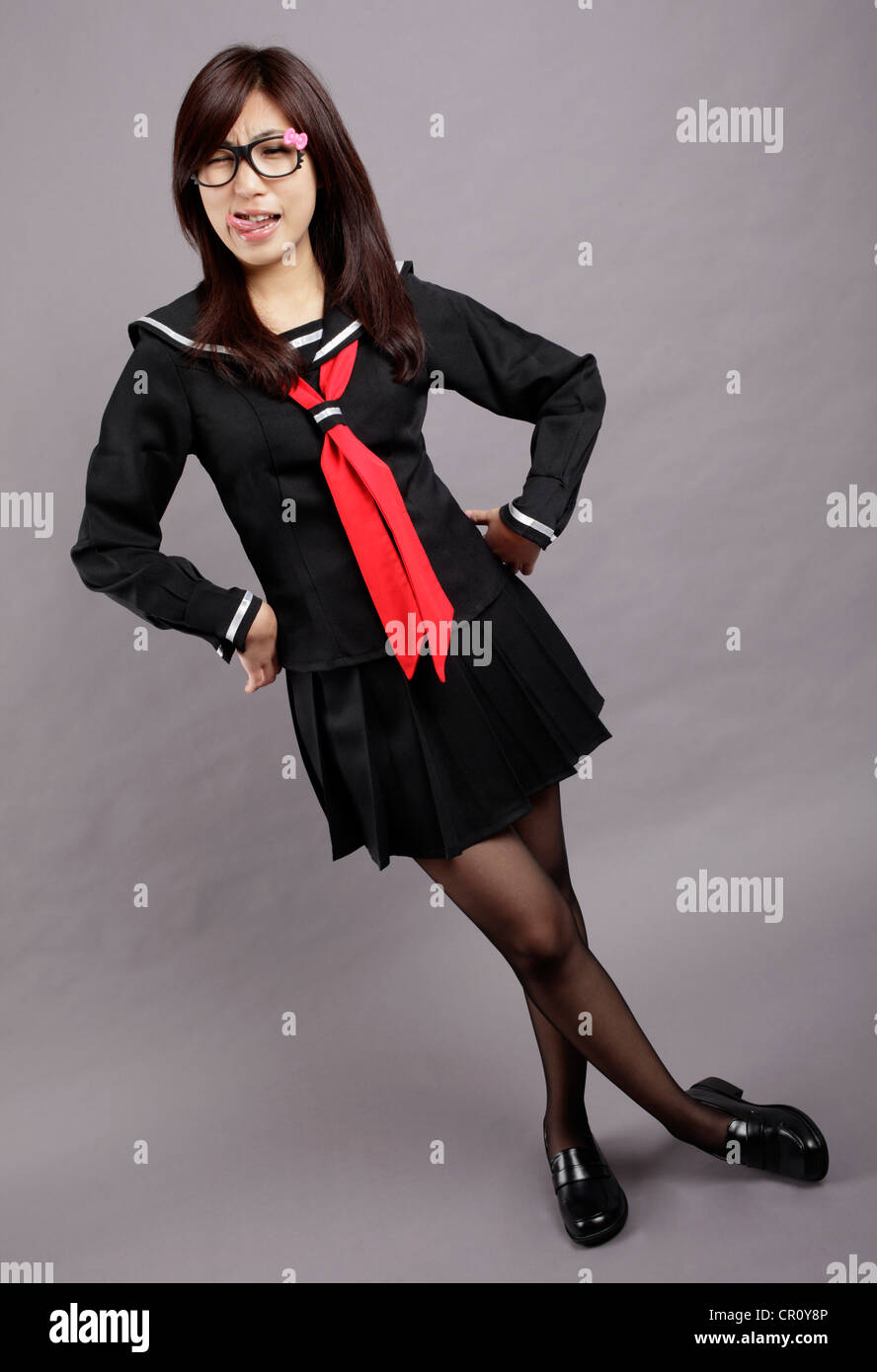 Portrait of school girl in black dress Stock Photo - Alamy