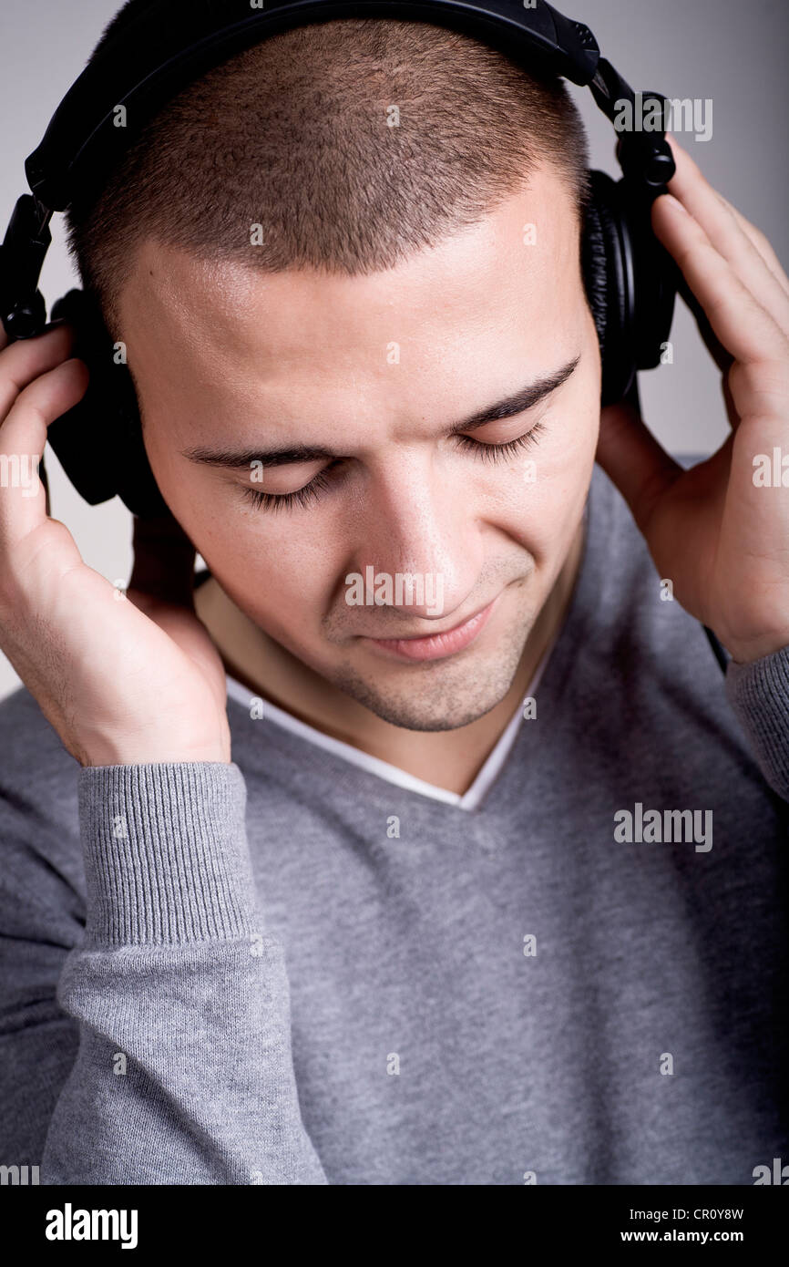 Portrait of a young man with headphones Stock Photo - Alamy