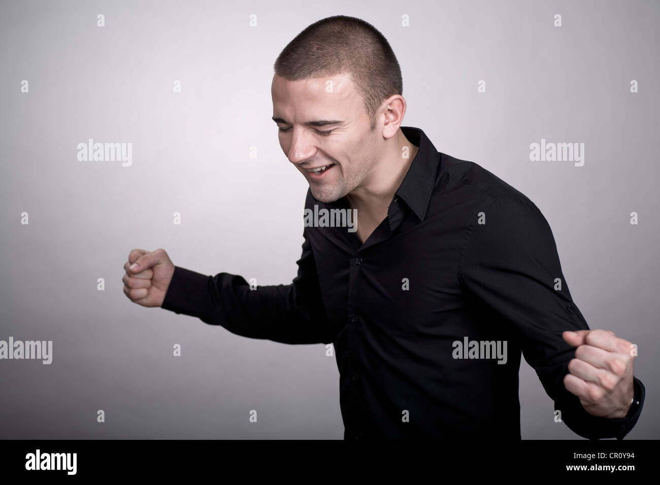 Young man, cheering Stock Photo - Alamy Young man, cheering Stock Photo - Alamy