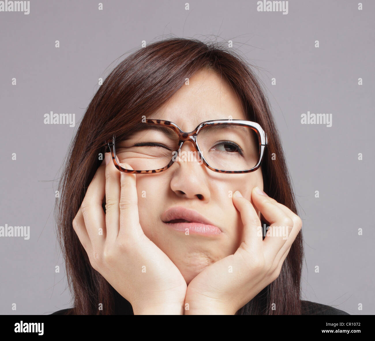 School girl is tired of studying book Stock Photo - Alamy