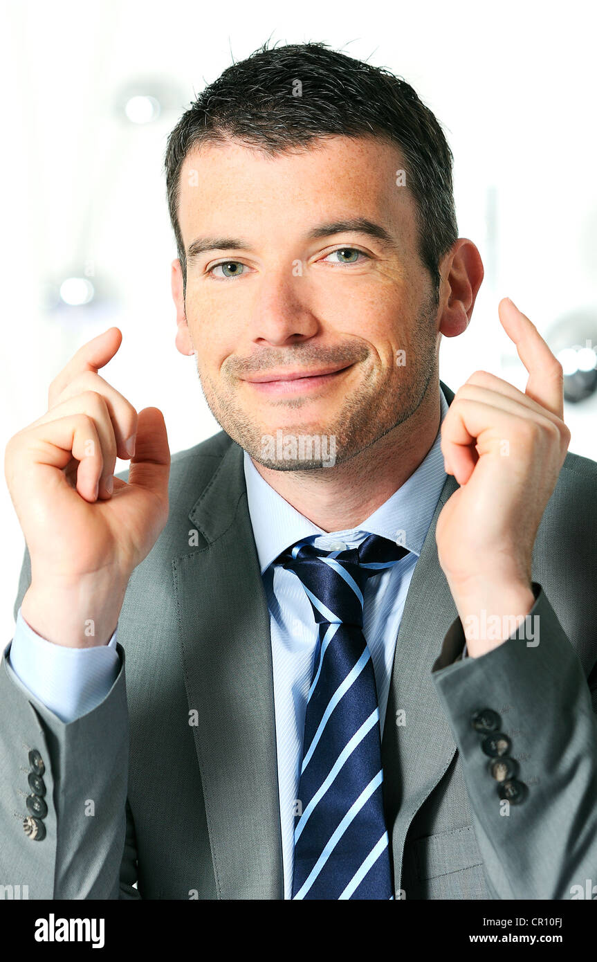 An attractive business man with succes Stock Photo - Alamy