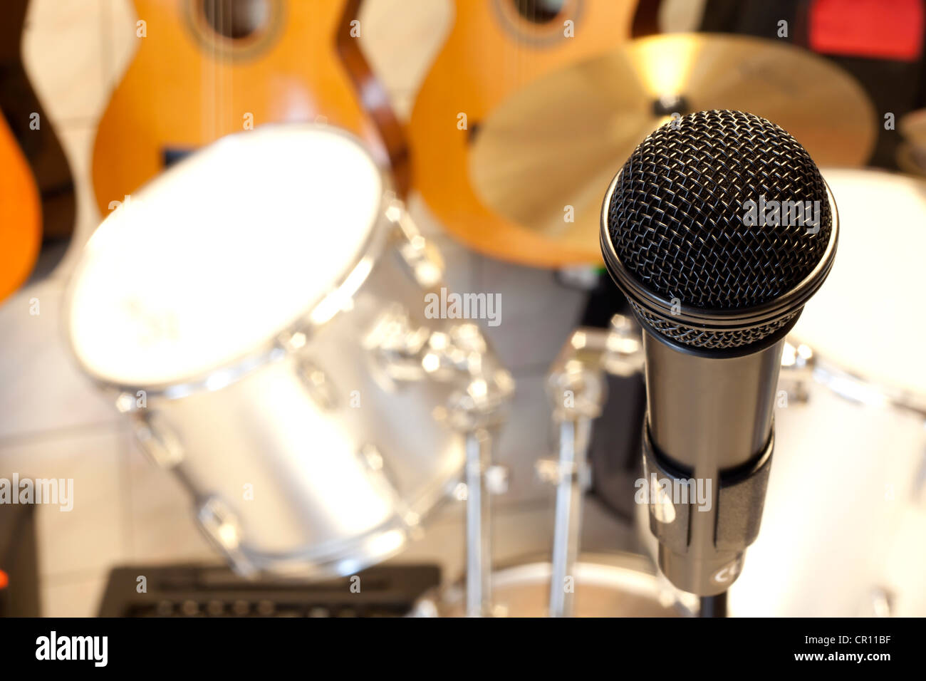 Microphone drums guitars in music studio abstract background Stock ...