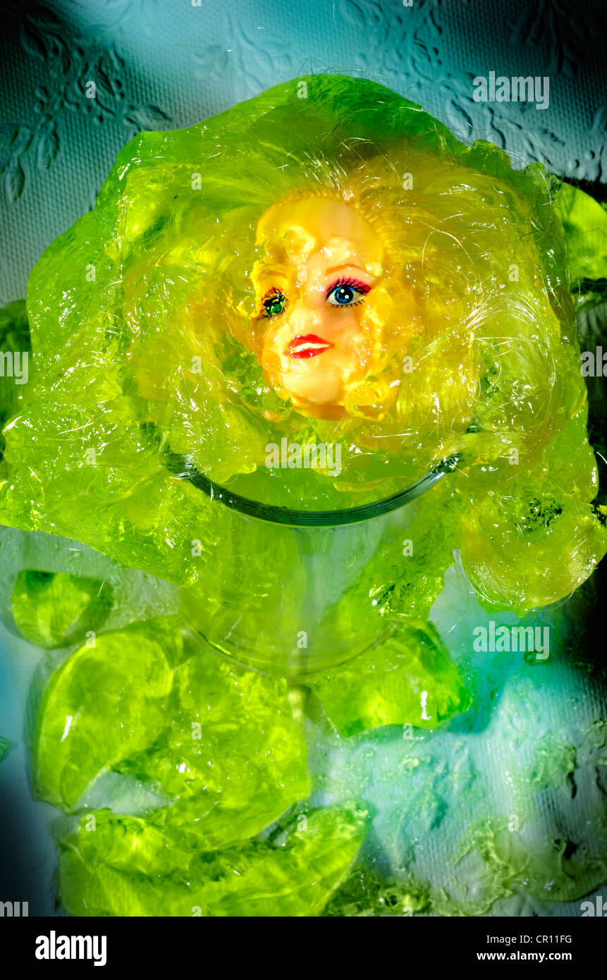 dolls head in green jelly Stock Photo - Alamy