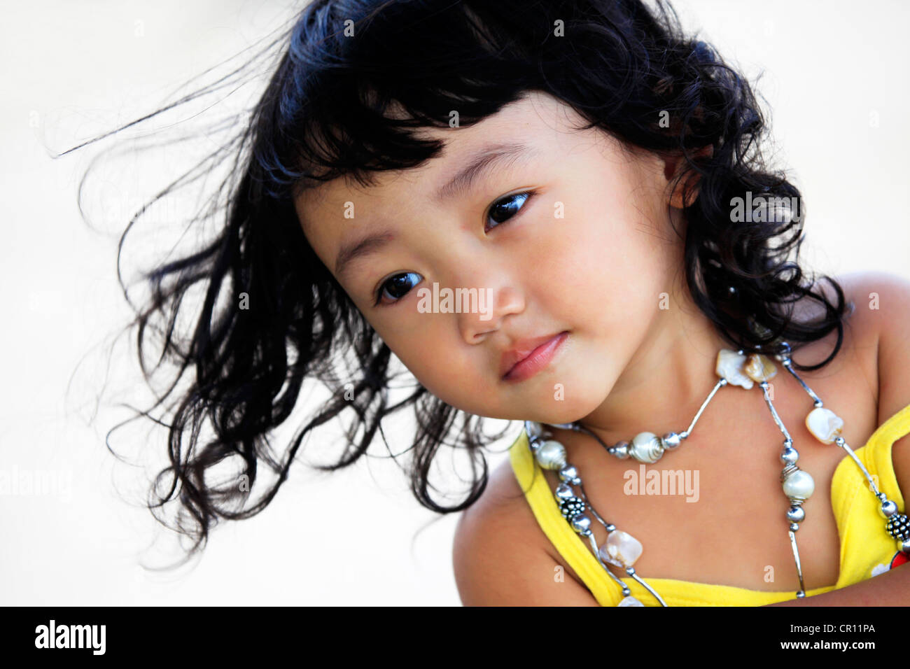 Portrait of the beautiful small Asian girl. Indonesia. Java Stock Photo ...