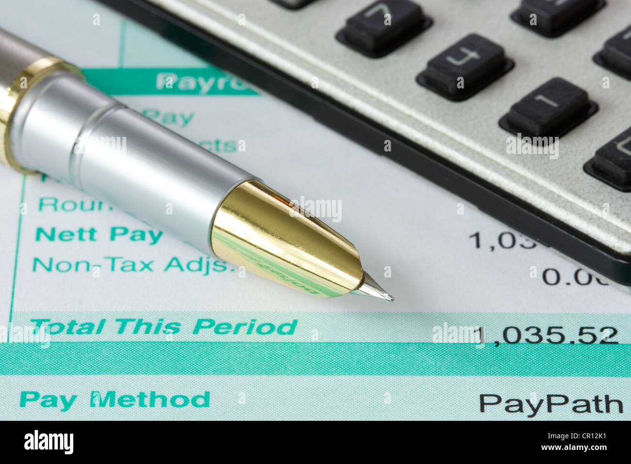 ink pen, calculator and payroll summary details Stock Photo - Alamy