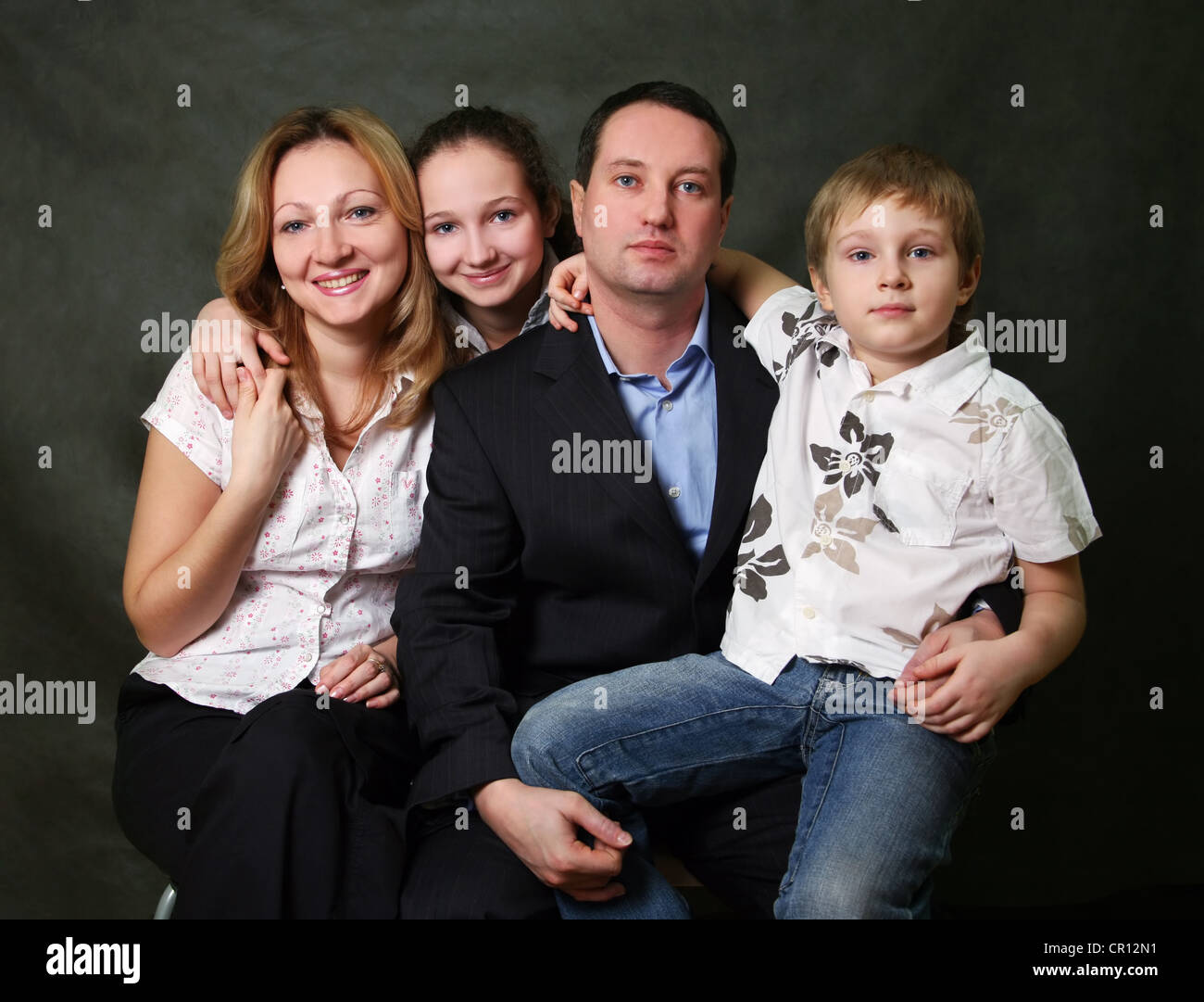 Portrait of parents and children in studio Stock Photo - Alamy