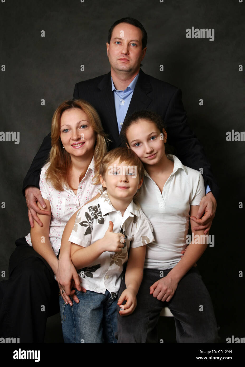 Portrait of parents and children in studio Stock Photo - Alamy