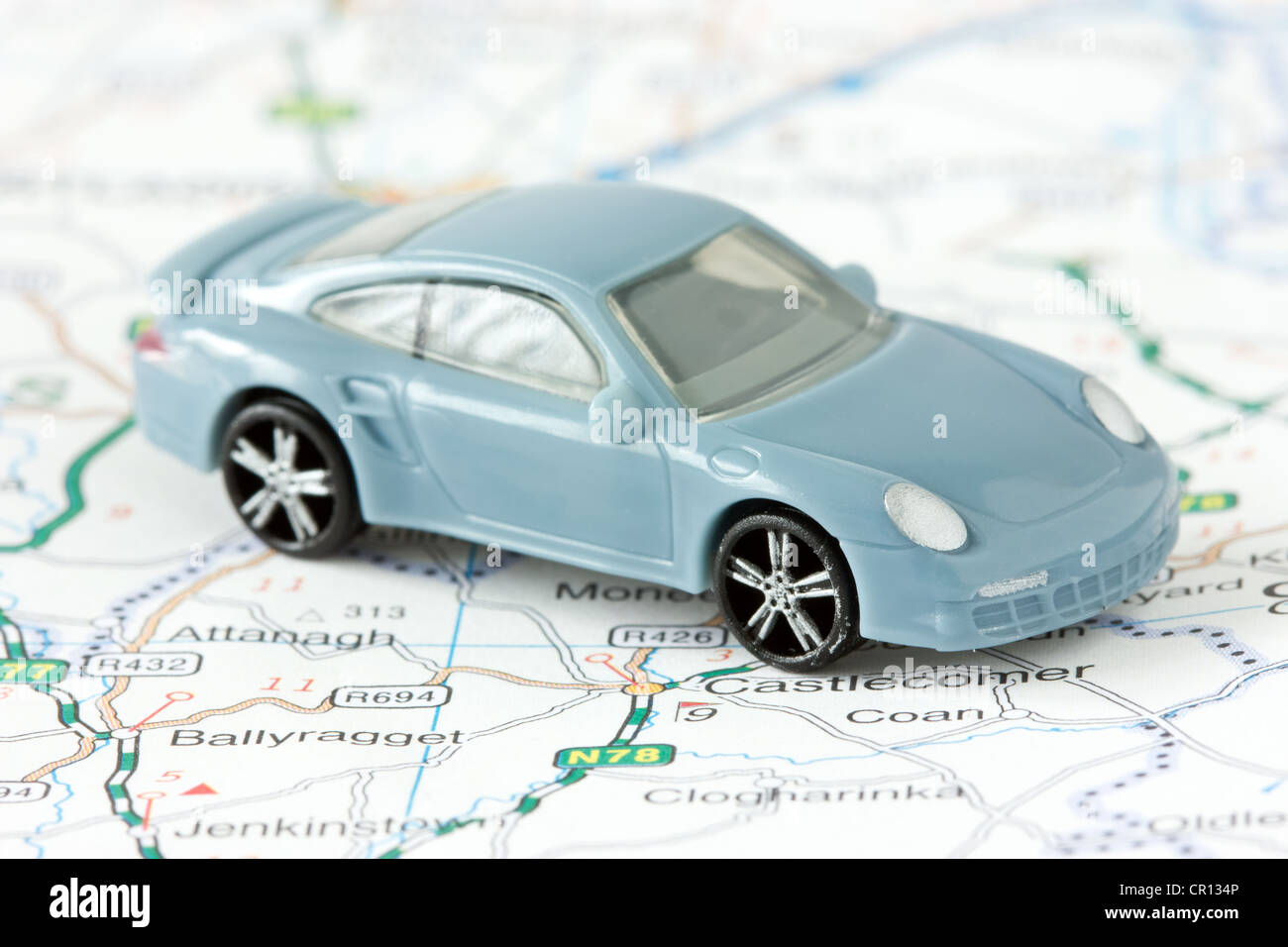 trip planning and travel. small car on map background Stock Photo - Alamy