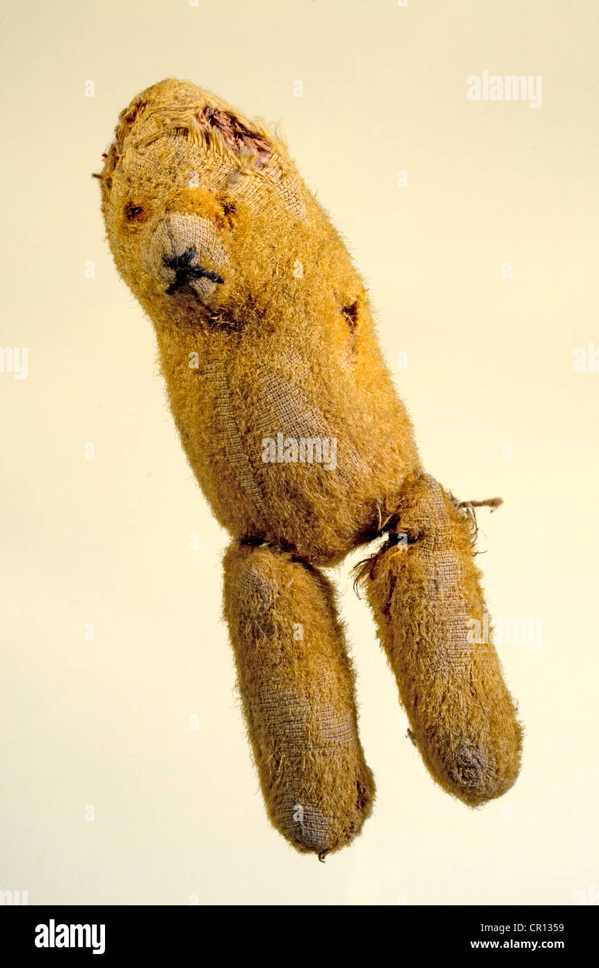 very old teddy bear with no arms and poor eyesight Stock Photo - Alamy