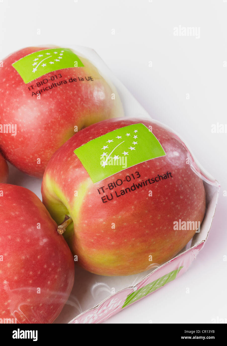 Wrapped pink lady organic certified apples in white background Stock ...
