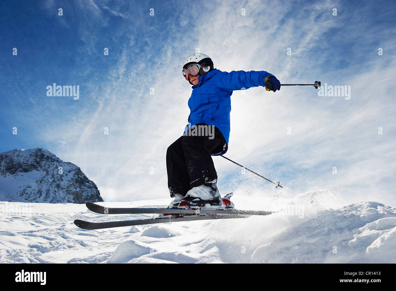 Boy skiing on snowy mountainside Stock Photo - Alamy