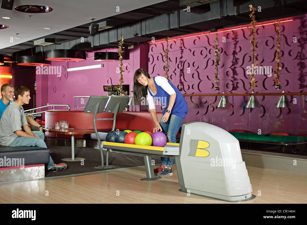 Photo of group of friends bowling Stock Photo - Alamy