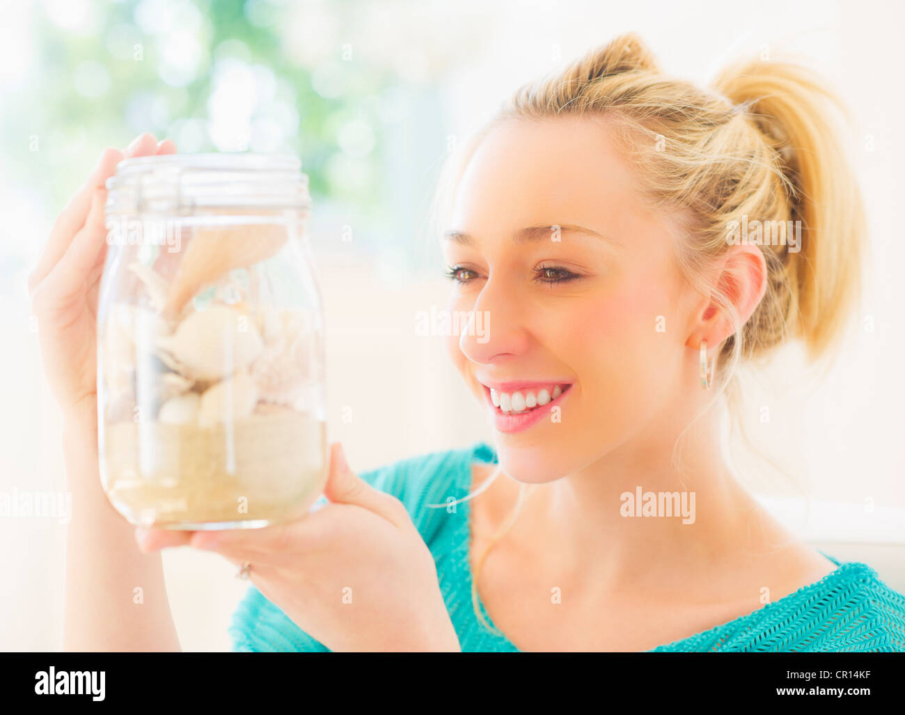 Woman holding jar on head hi-res stock photography and images - Alamy