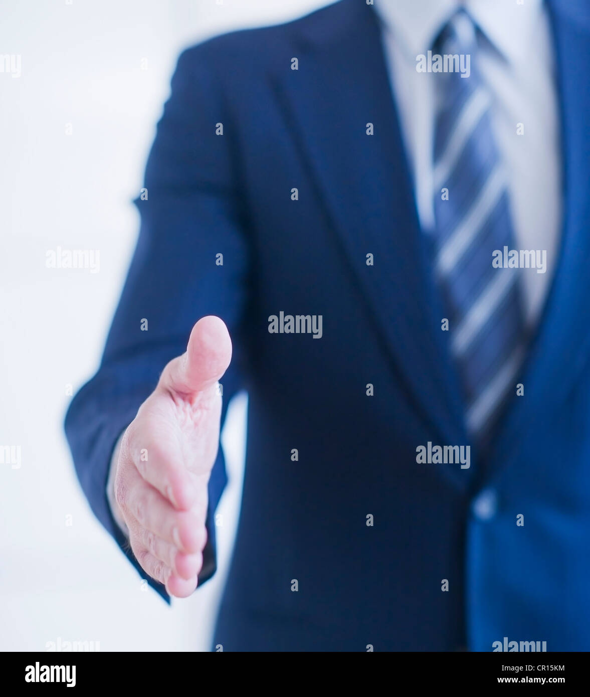 Businessman waiting to shake hands Stock Photo - Alamy