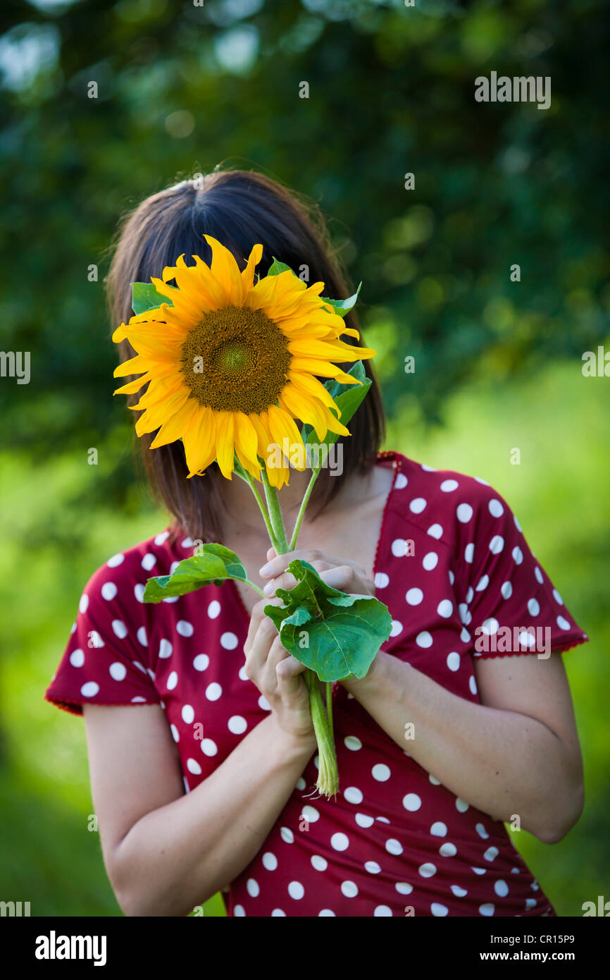 Girl Hiding Face With Flower