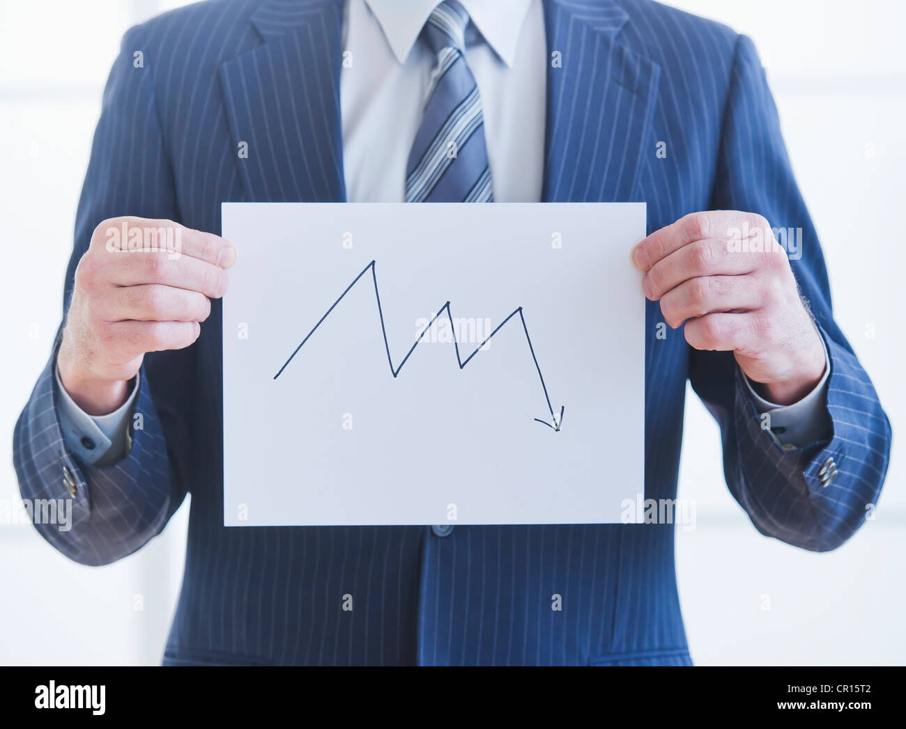 Man wearing suit holding chart Stock Photo - Alamy