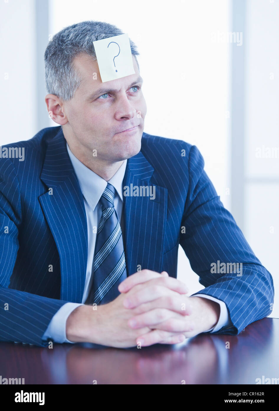 Portrait of businessman with label on forehead Stock Photo - Alamy