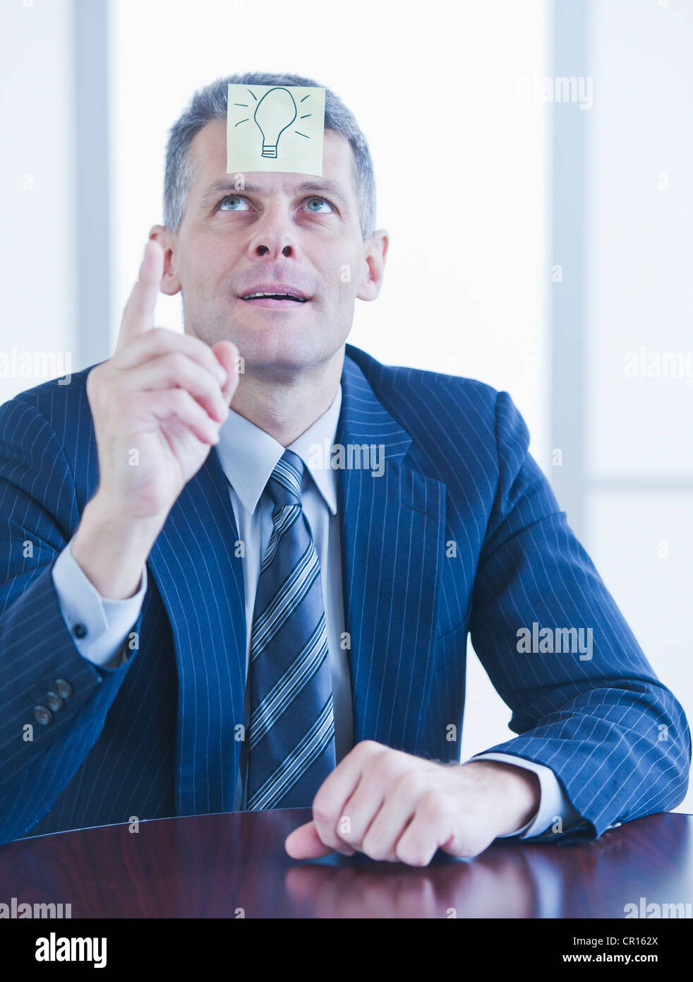 Portrait of businessman with label on forehead Stock Photo - Alamy