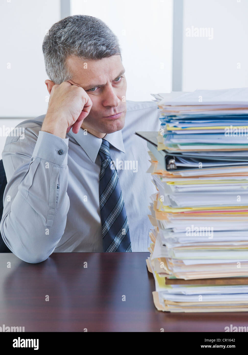Serious businessman looking documents hi-res stock photography and ...