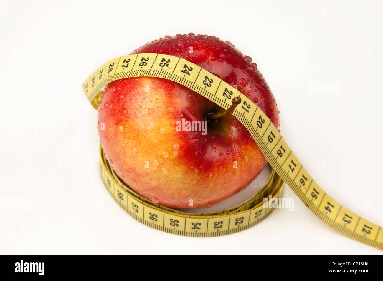 Apple with measuring tape Stock Photo - Alamy