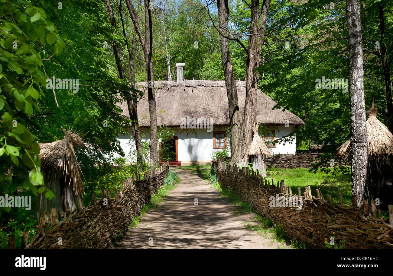 Road to rustic cottage with fence Stock Photo - Alamy