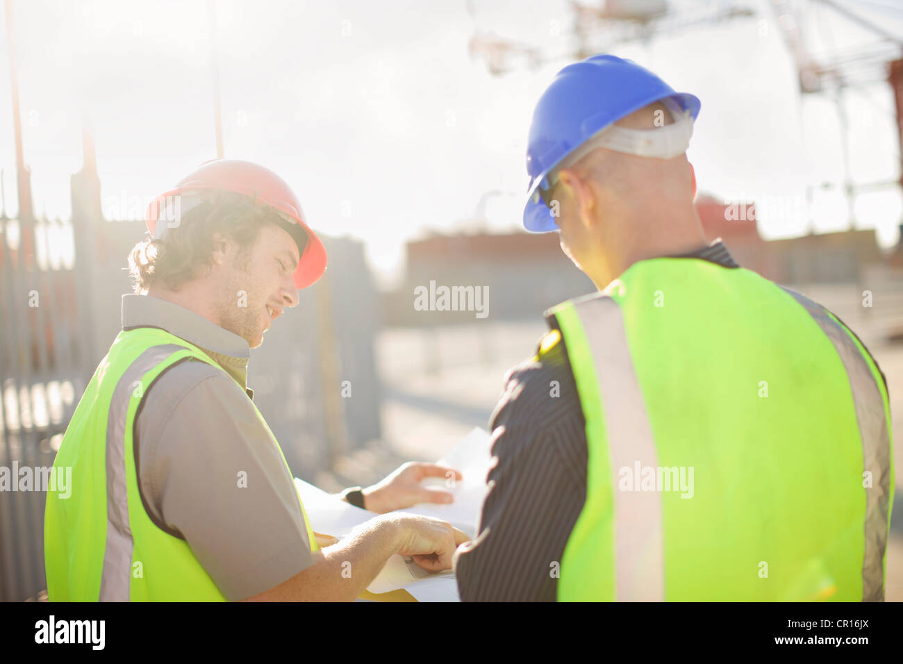 Construction workers talking on site Stock Photo - Alamy