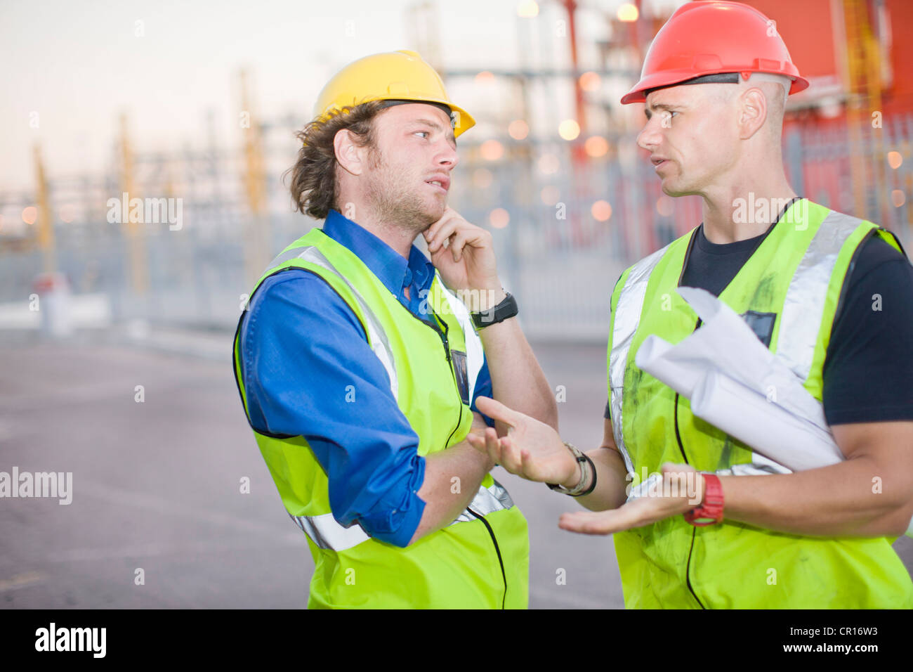 Construction workers talking on site Stock Photo - Alamy