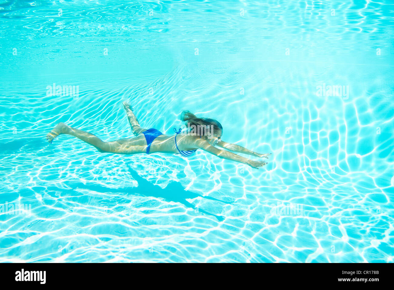 Woman In Bikini Swimming In Pool Stock Photo Alamy
