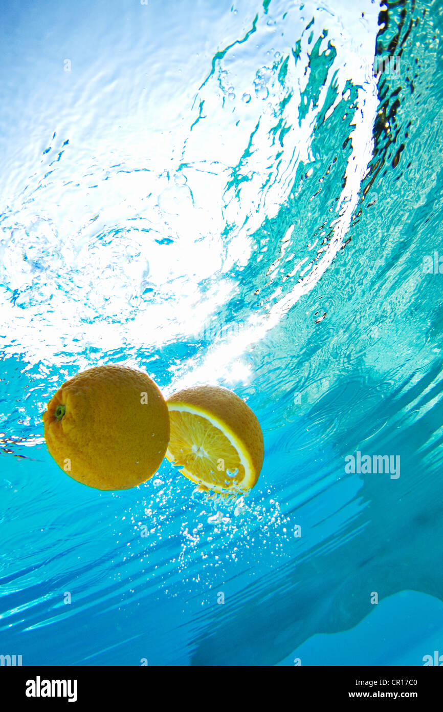 Lemon floating in swimming pool Stock Photo - Alamy