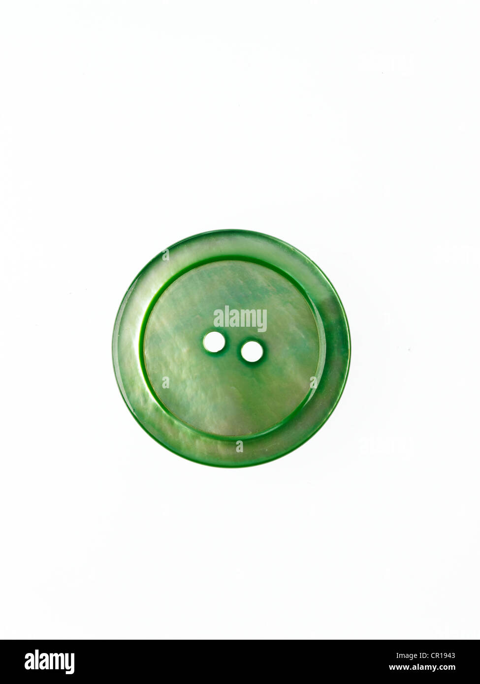 Studio shot of single green button Stock Photo - Alamy