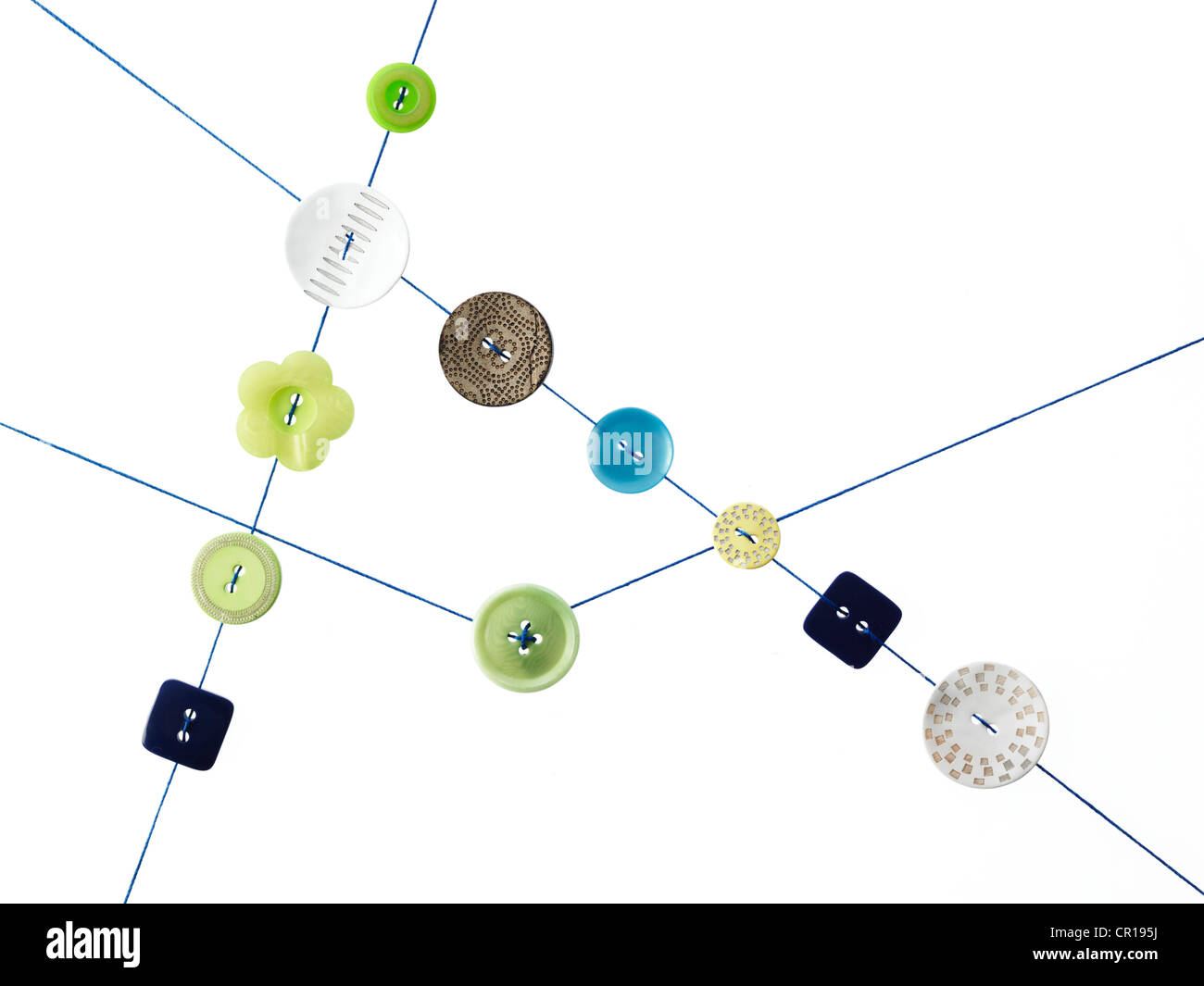 Studio shot of diagram made of thread and buttons Stock Photo - Alamy