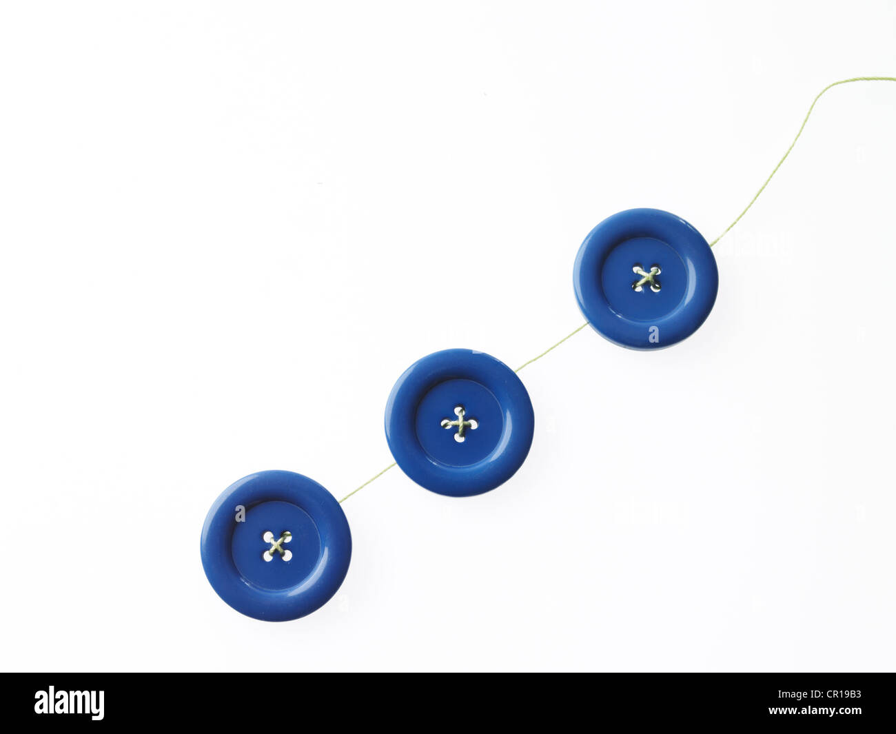 Studio shot of blue buttons in a row Stock Photo - Alamy
