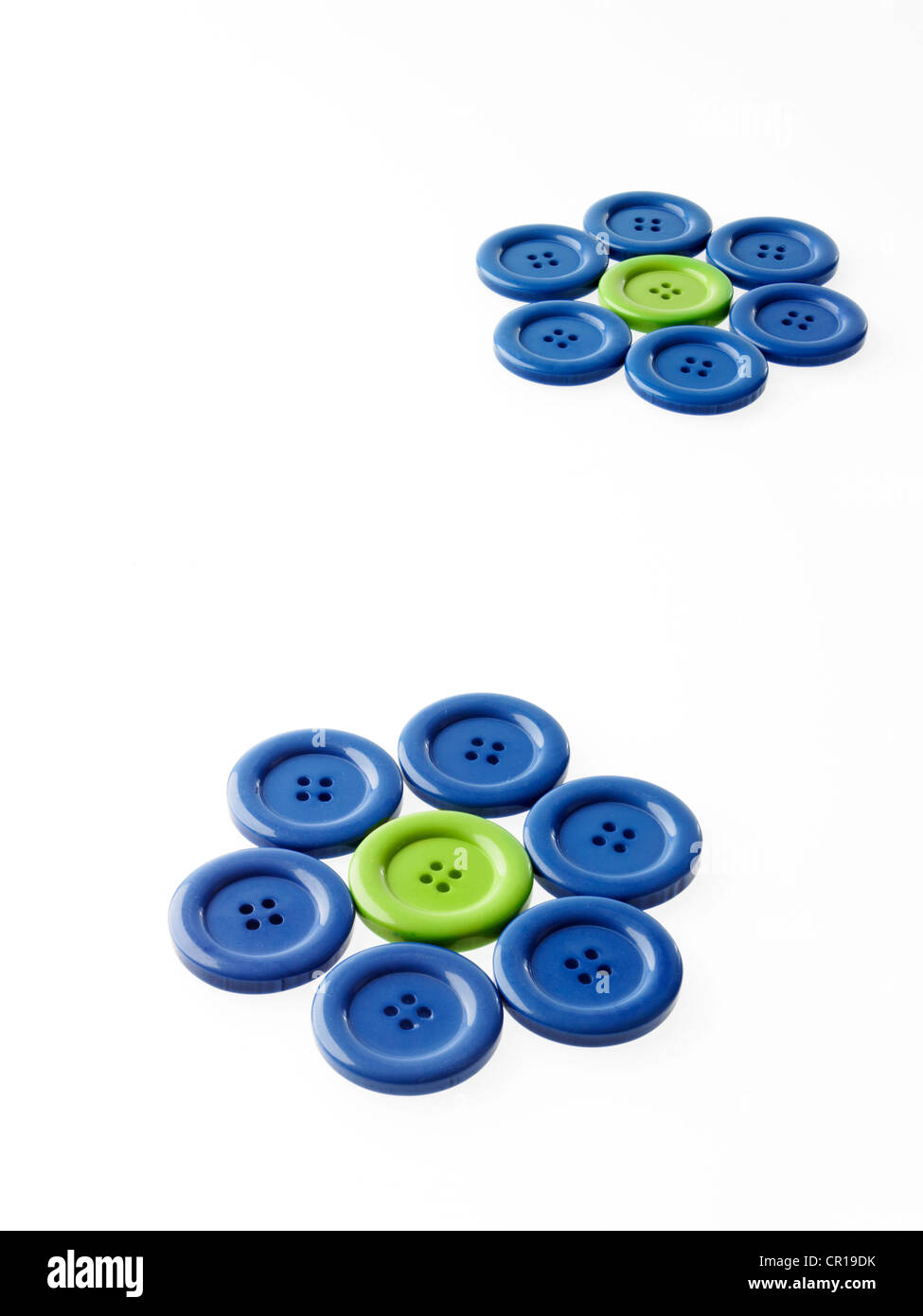 Studio shot of blue and green buttons arranged in flower head Stock ...