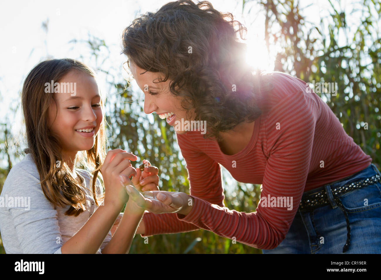 Mother and daughter talking outdoors Stock Photo - Alamy