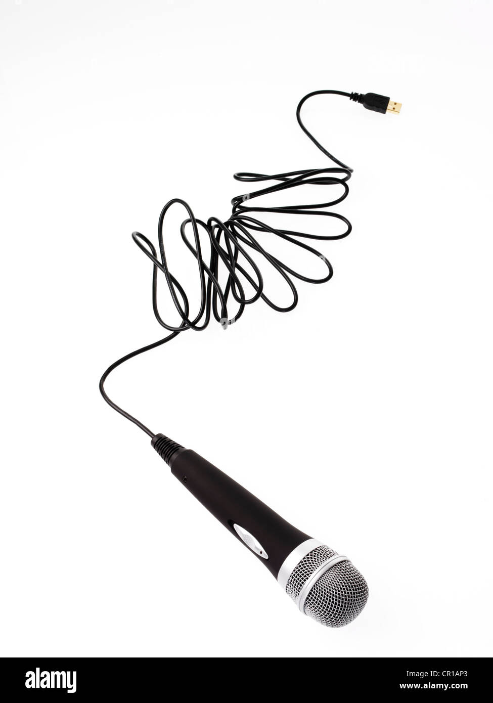 Studio shot of microphone and microphone cable on white background ...