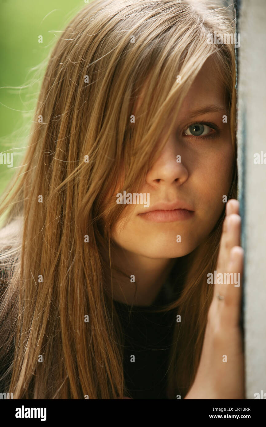 The young girl about a wall, looking frustration Stock Photo - Alamy