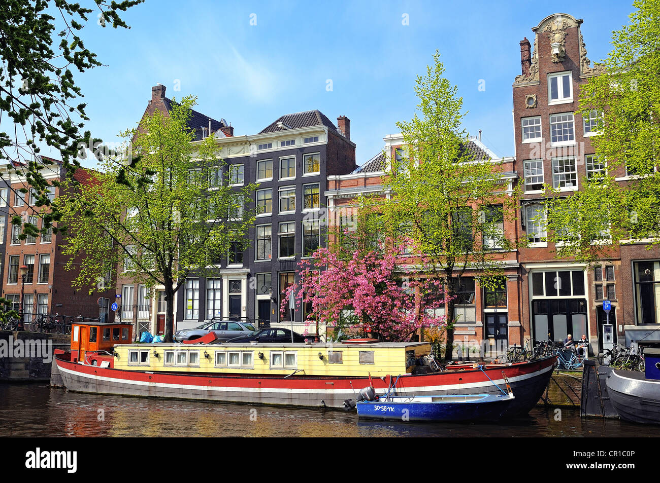 Netherlands, Amsterdam, barges and housing along the canal Stock Photo ...