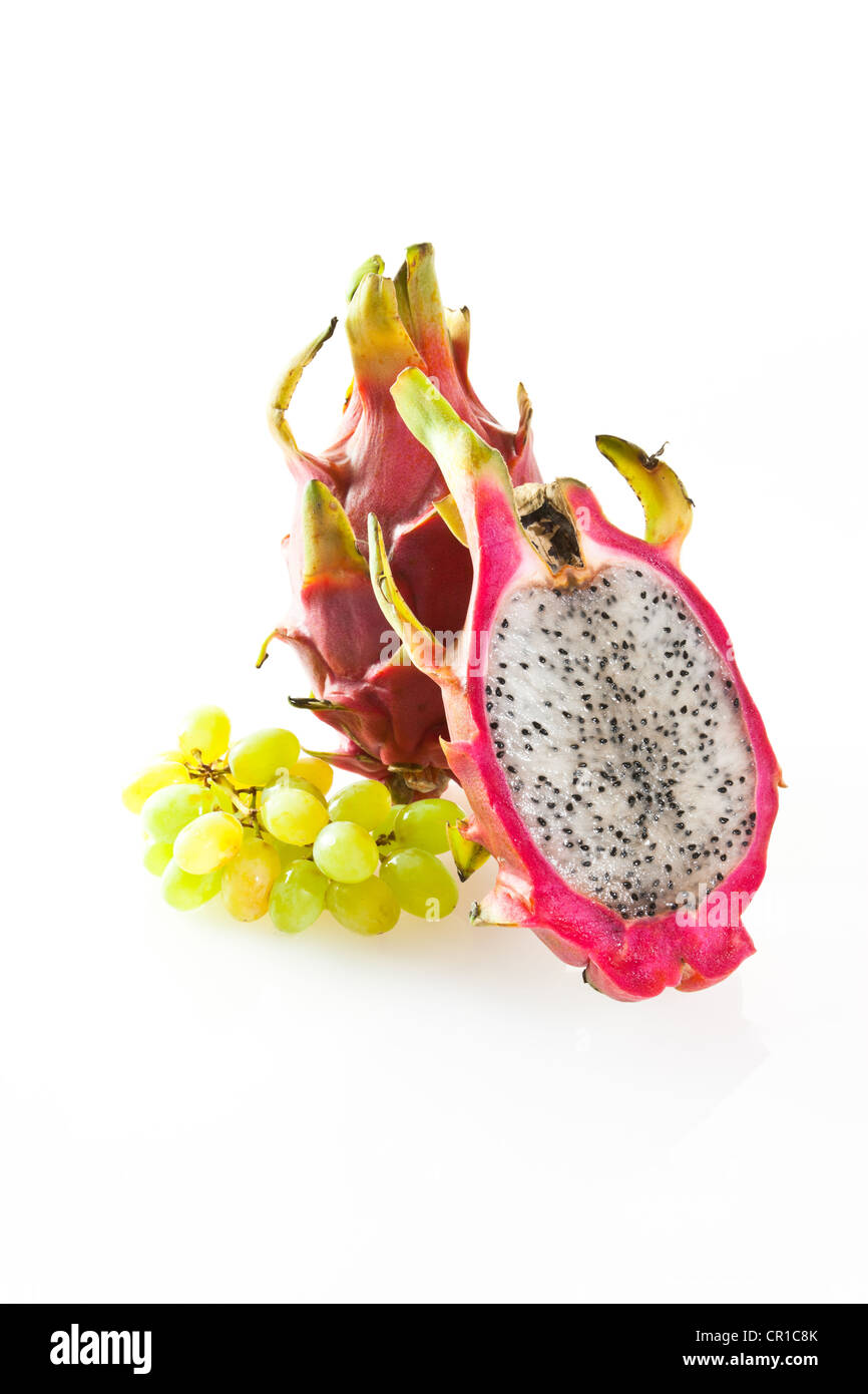 Red pitaya or dragon fruit (Hylocereus undatus) with white grapes Stock ...