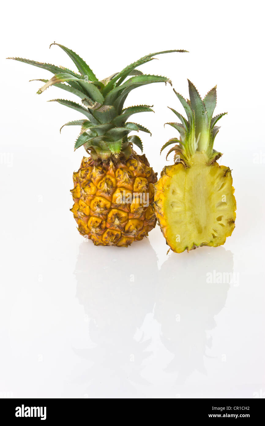 Two Pineapples (Ananas comosus), one cut in half Stock Photo - Alamy