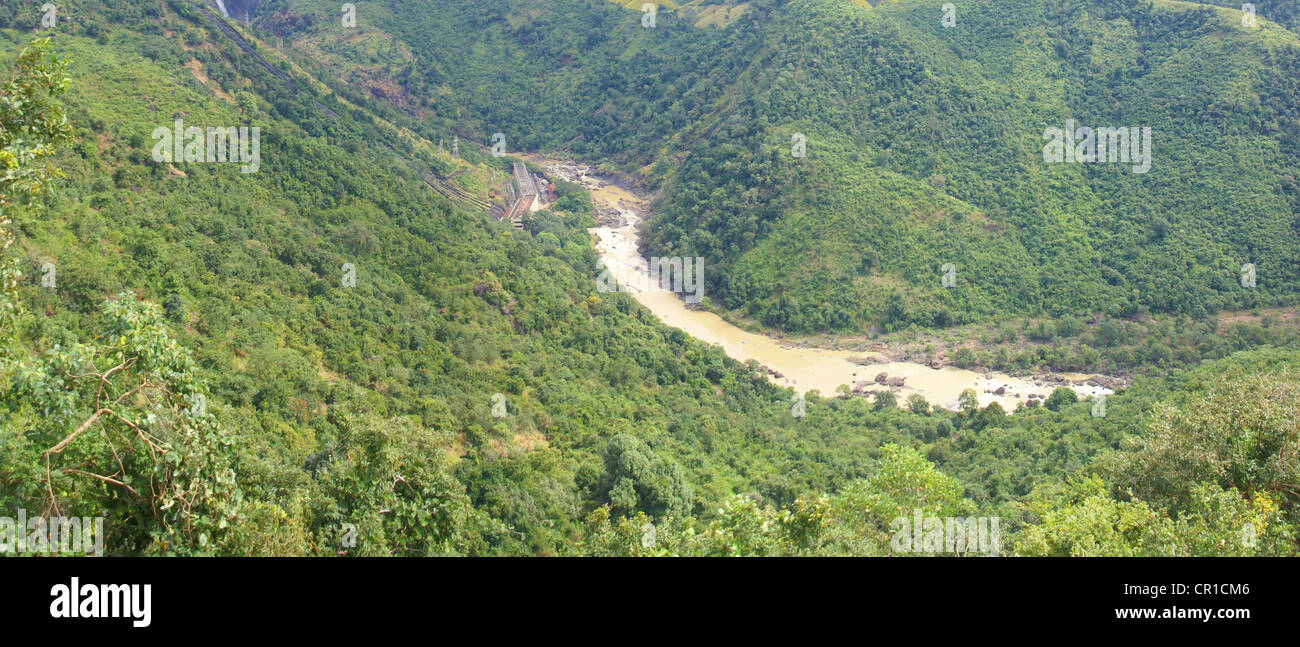 Muddy river meanders through jungle hills, of Orissa, India Stock Photo ...