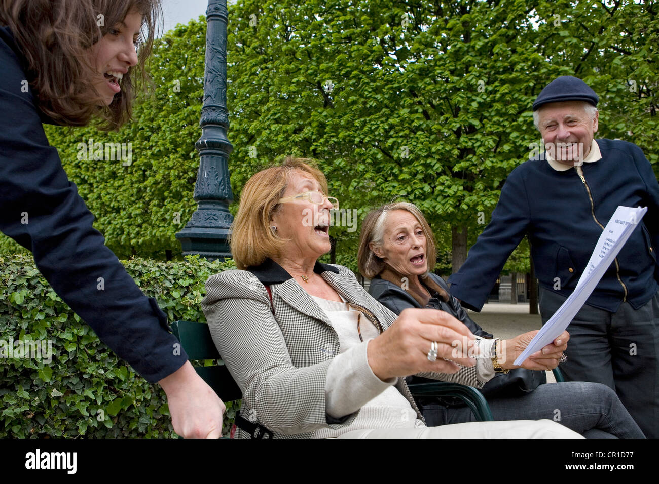 France, Paris, group singing in the Palais Royal Gardens Stock Photo ...