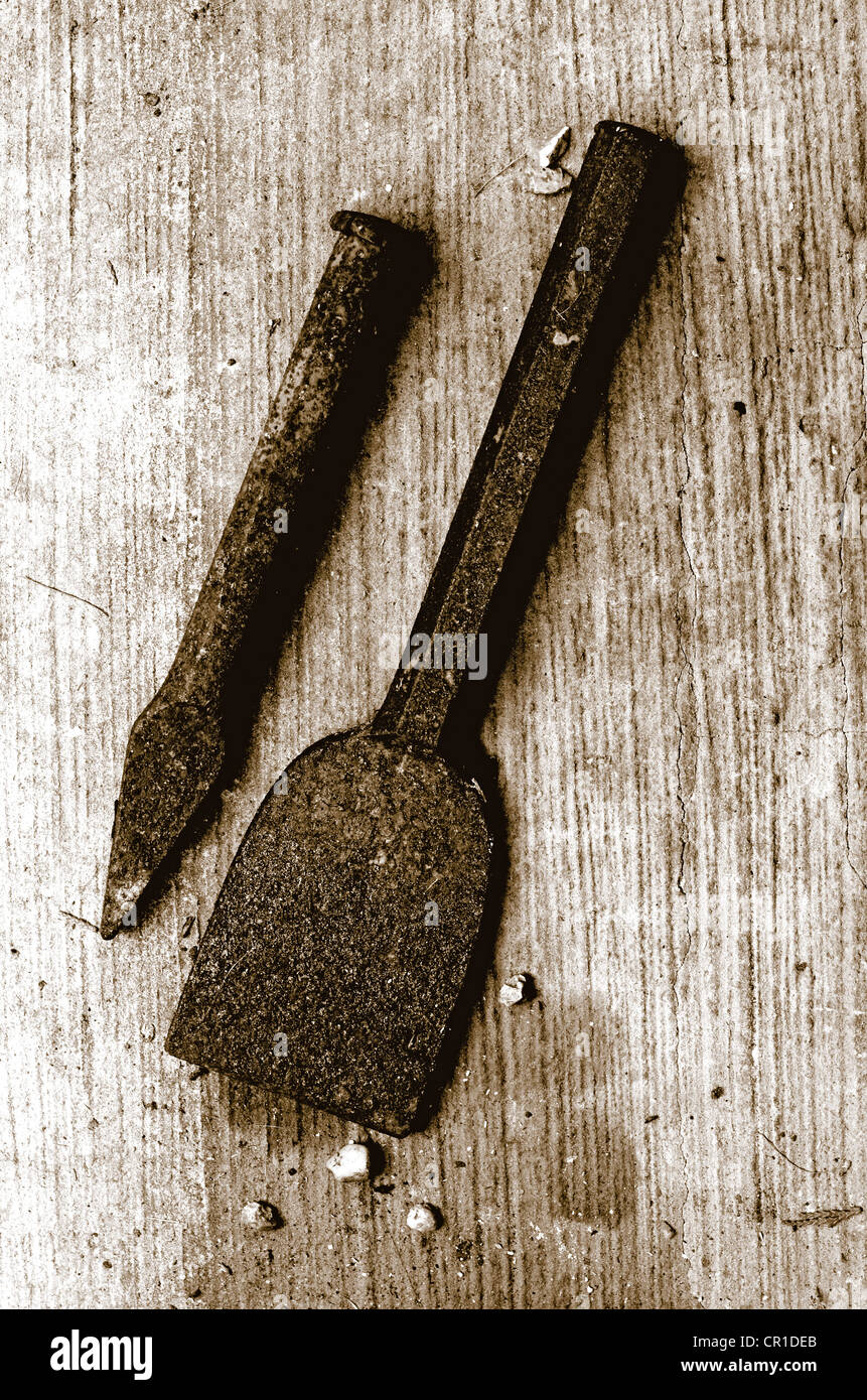 old rusty tools on concrete floor Stock Photo - Alamy