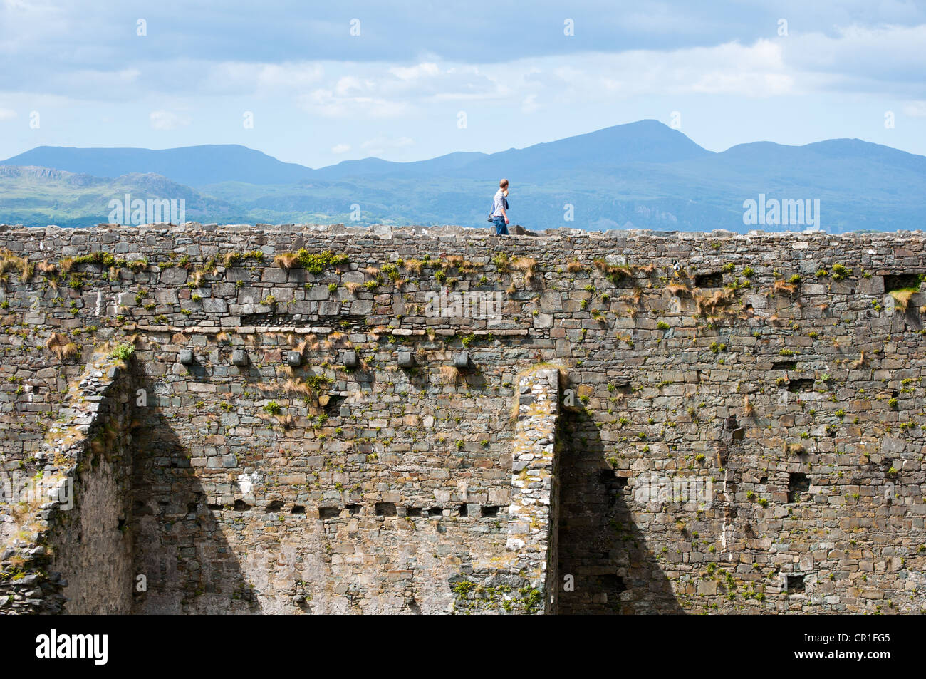 Harlech Castle dominates Harlech town with thick walls and astonishing ...