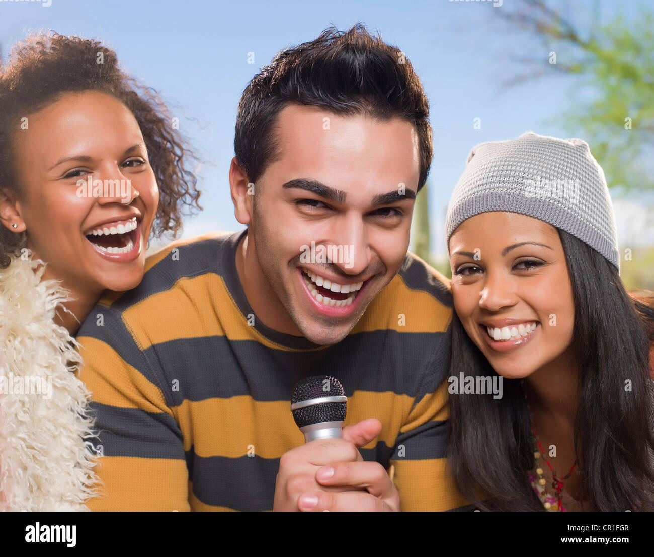 Friends singing together outdoors Stock Photo - Alamy