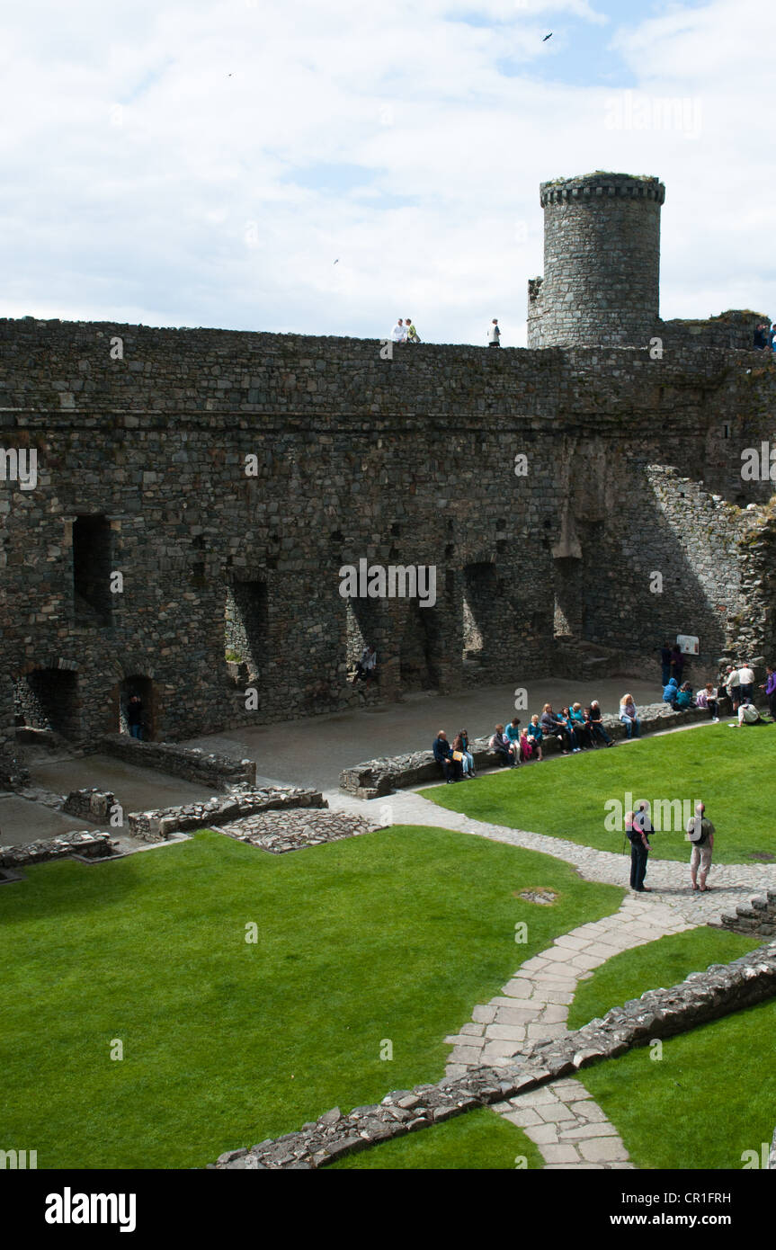 Harlech Castle dominates Harlech town with thick walls and astonishing ...