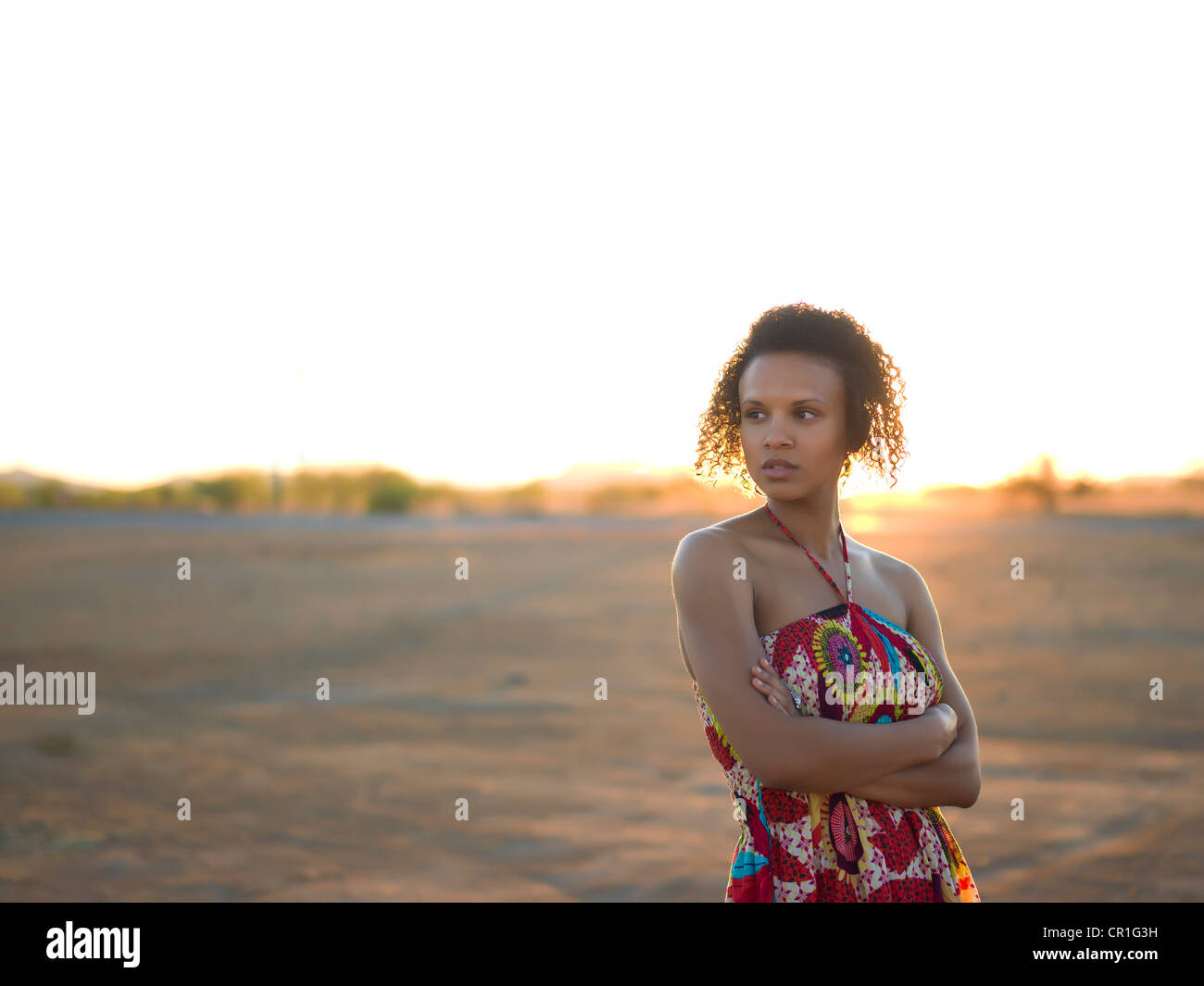 Woman standing in desert landscape Stock Photo - Alamy