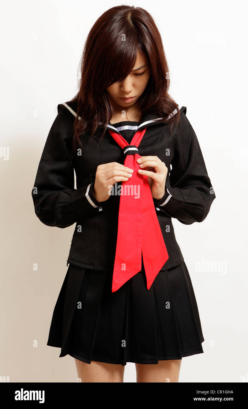 Portrait of school girl in black dress Stock Photo - Alamy