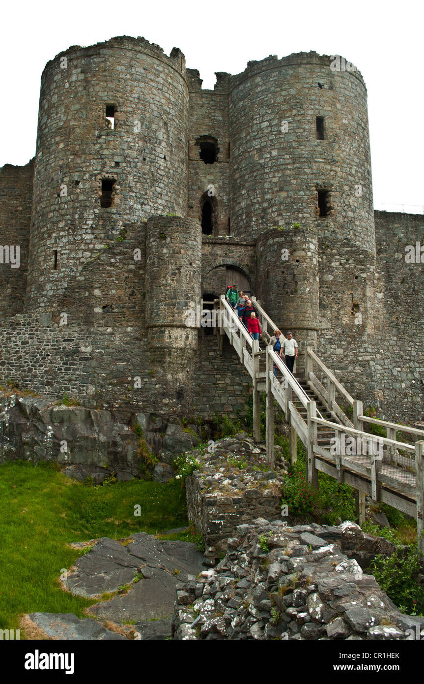 Harlech Castle dominates Harlech town with thick walls and astonishing ...