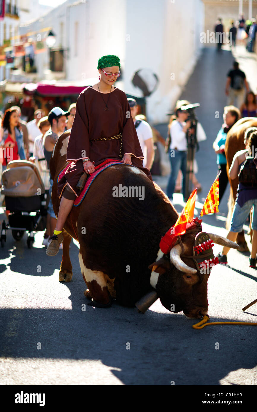 Woman riding on Bull, Ibiza Stock Photo - Alamy